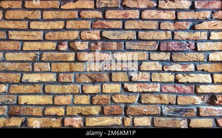 A brick wall, made of treated, antique-styled brick. High quality ...