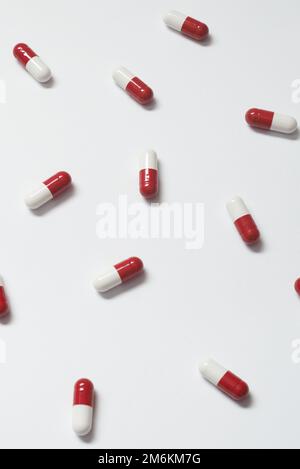 Pharmaceutical capsules over white backdrop Stock Photo - Alamy