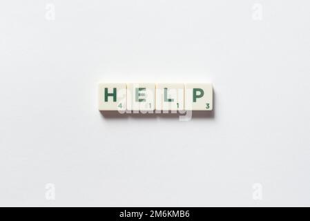 Help formed of scrabble blocks Stock Photo - Alamy