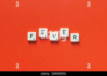 Fever formed of scrabble tiles Stock Photo - Alamy
