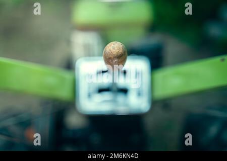 Gear lever on a walk-behind tractor close-up on a blurred background ...
