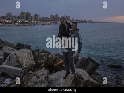 Palestinian men seen enjoying themselves at the Gaza beach during ...