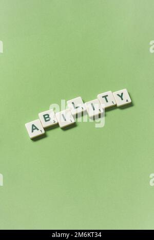 Growth formed of scrabble tiles on white background Stock Photo - Alamy