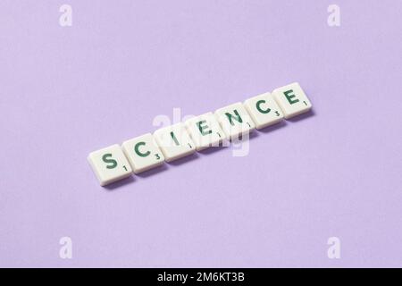 Science formed of scrabble elements on lilac background Stock Photo - Alamy