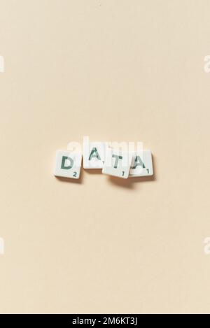Data formed of scrabble blocks on beige background Stock Photo - Alamy