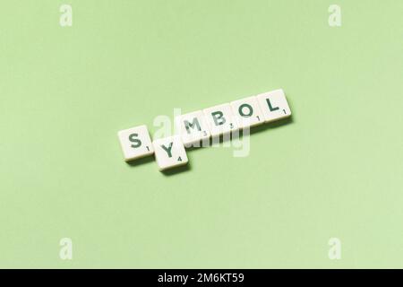 Design formed of scrabble blocks on pink background Stock Photo - Alamy