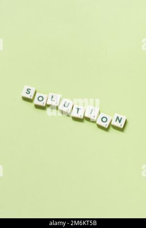 Solution formed of scrabble tiles on green background Stock Photo - Alamy