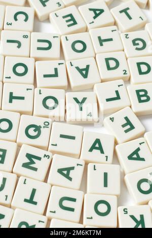 Scrabble letters on white background Stock Photo - Alamy