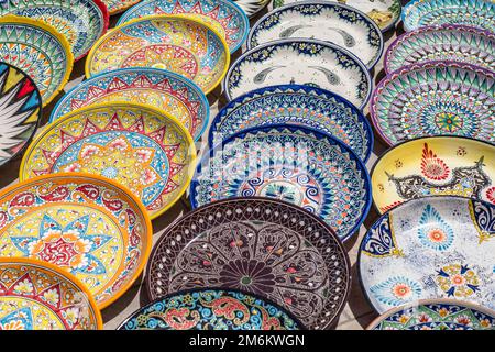 Decorative ceramic plates with traditional uzbek ornament in the street ...