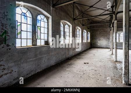 Storage rooms of a historic flour mill with cast iron columns Stock ...