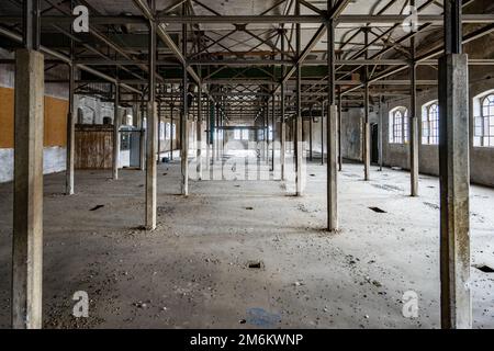Storage rooms of a historic flour mill with cast iron columns Stock ...