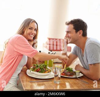 Young loving couple having lunch in the modern restaurant Stock Photo ...