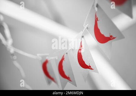 A garland of Easter Island national flags on an abstract blurred ...
