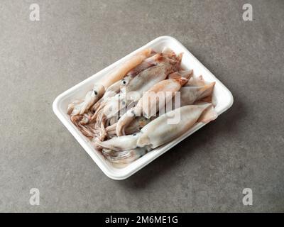 fresh squid in packaging container Stock Photo - Alamy