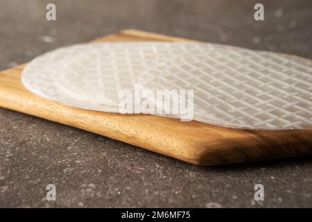 Rice paper on cutting board Stock Photo - Alamy