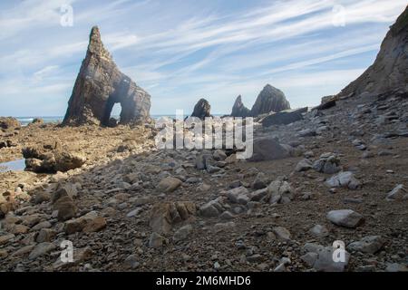 Rock formations in a stoney beach in Asturias, Spain Stock Photo - Alamy