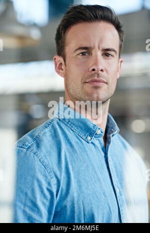 Hes a model employee. a casually-dressed businessman standing in his ...