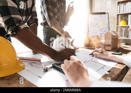 Architect team working with blueprints for architectural plan, engineer ...