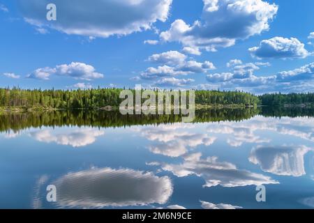 Landscape with a symmetrical reflection on the Vyg river (part of the ...