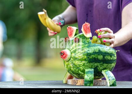 creative pig shaped fruit bowl made of watermelon, creativity concept ...