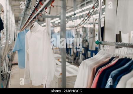 Dry cleaning clothes. Clean cloth chemical process. Laundry industrial ...