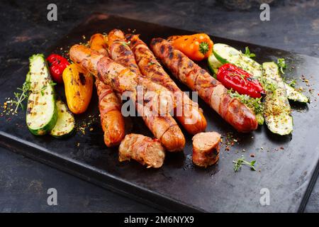 Traditional barbecue Bernese sausage with grilled vegetables served as ...
