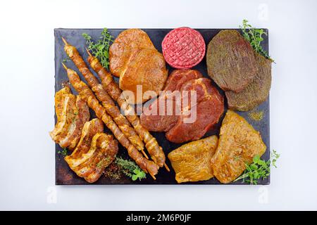 Traditional raw grill platter with hamburger Stock Photo - Alamy