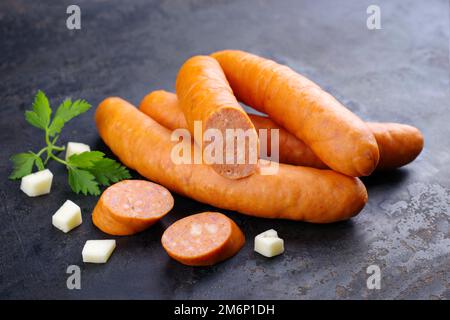 Traditional raw Austrian fine cheese sausage with cheese offered as ...