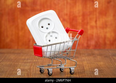 Electric socket in small shopping trolley Stock Photo - Alamy