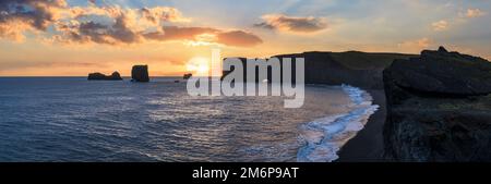 Picturesque autumn evening view to Dyrholaey coast cliffs and rocky ...