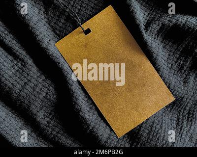 Blank fashion label tag, sale price card on luxury fabric background ...