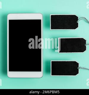 Clipboard, tablet computer, mobile phone and pills on table in doctor's ...