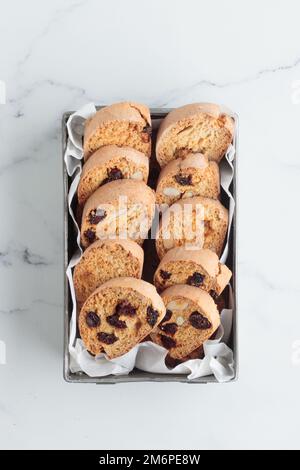 Biscotti in a metal box cantucci cookies with almond and cranberry on ...
