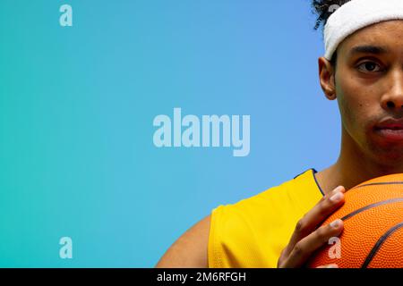 Image of biracial basketball player with basketball and copy space on ...