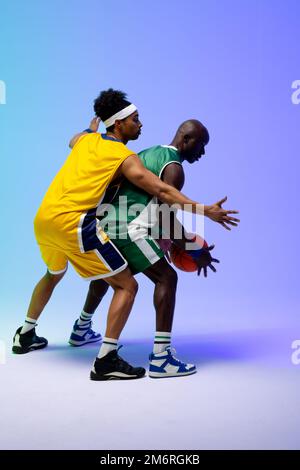 Image of two diverse basketball players with basketball playing on ...