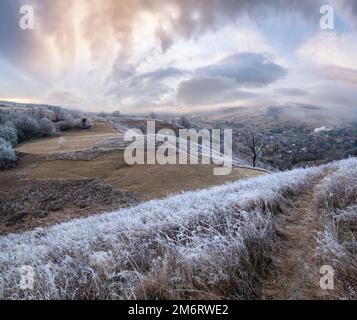 Winter coming. Picturesque pre sunrise scene above late autumn mountain ...