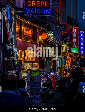 Paris crowded street night scene Stock Photo - Alamy