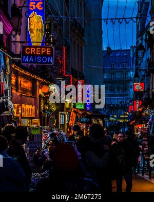Paris crowded street night scene Stock Photo - Alamy