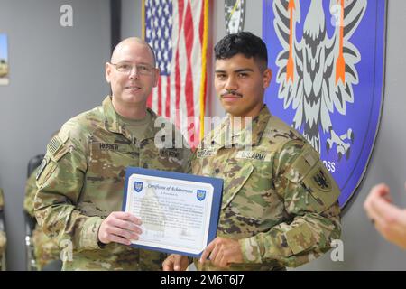 U.S. Army Sgt. Maj. Michael Gragg, left, command senior enlisted leader ...