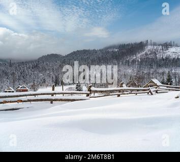 Winter remote alpine mountain village outskirts, countryside hills ...