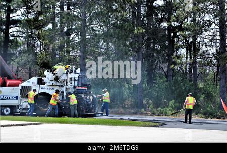 Workers with Mathy Construction of Onalaska, Wis., complete road ...