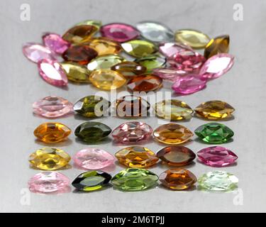 Natural beautiful stones multicolored tourmaline on a gray background ...
