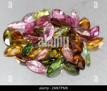 Natural beautiful stones multicolored tourmaline on a gray background ...