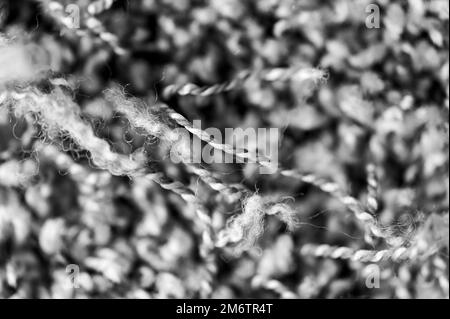 Loose carpet threads coming out of a seam Stock Photo - Alamy