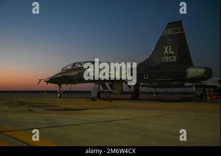 A T-38 Talon is parked on the flightline during a sunset at Laughlin ...