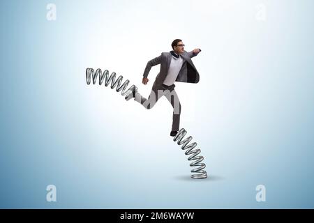 Businessman jumping on springboard as progress concept Stock Photo - Alamy