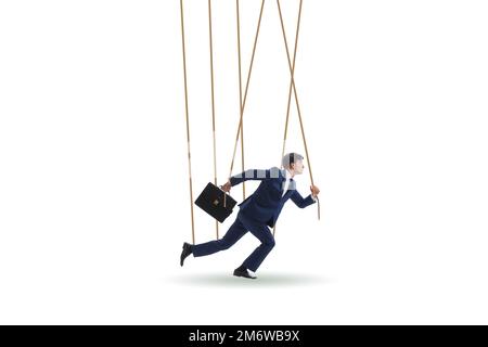 Businessman puppet being manipulated by the ropes Stock Photo - Alamy