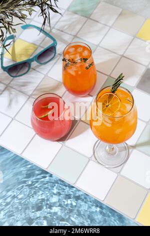 Tropical drink on the edge of a swimming pool on a sunny day Stock ...