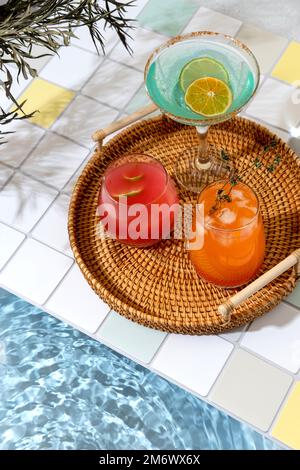 Tropical drink on the edge of a swimming pool on a sunny day Stock ...