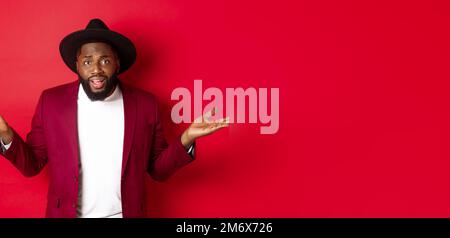 Image of confused Black man asking question, spread hands sideways and ...